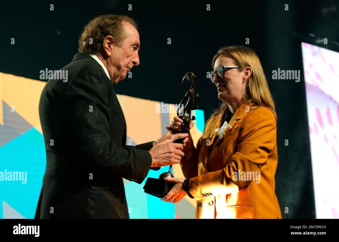 Eric Idle, left, presents Sarah Polley with the award for director of ...