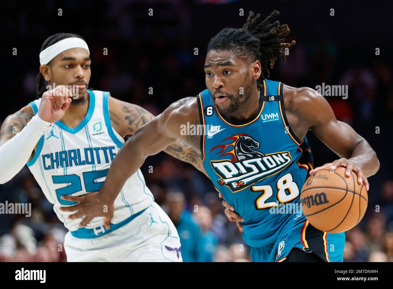 Detroit Pistons center Isaiah Stewart, right, drives past Charlotte ...
