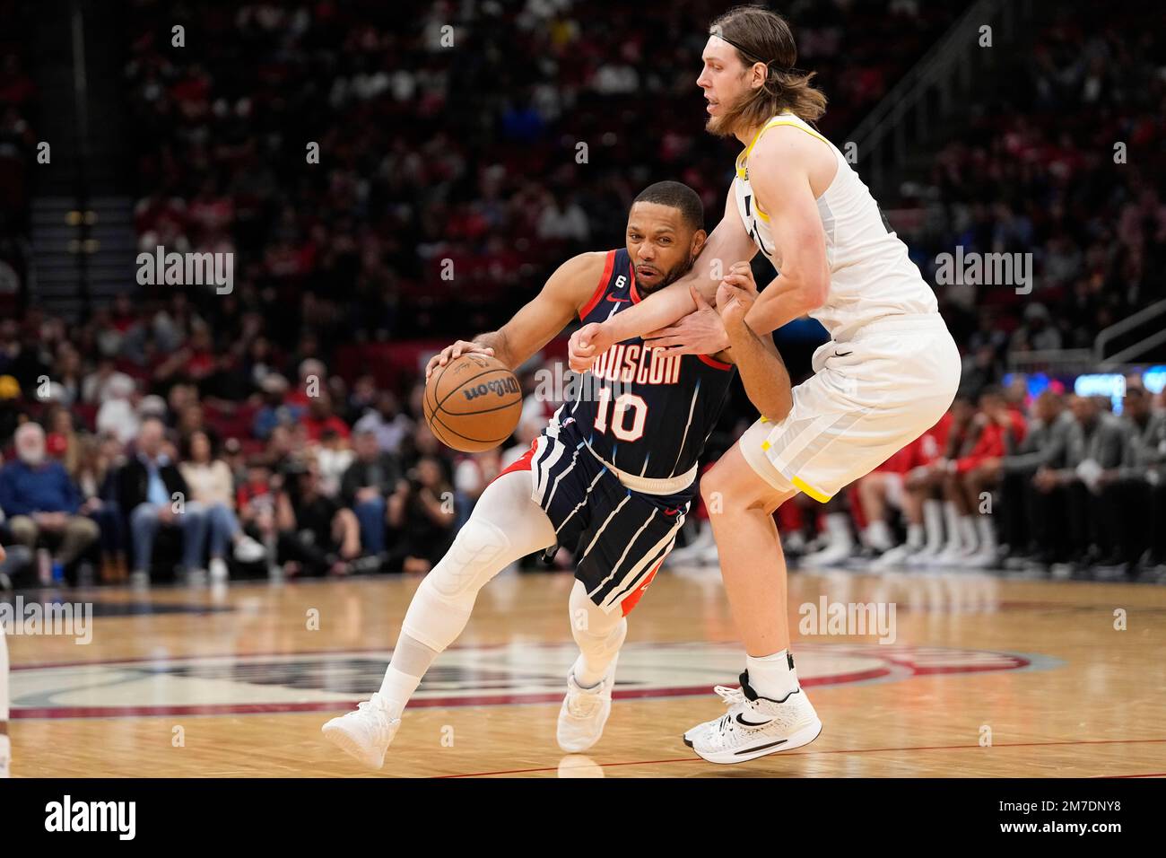 Houston Rockets' Eric Gordon (10) is fouled by Utah Jazz's Kelly Olynyk ...