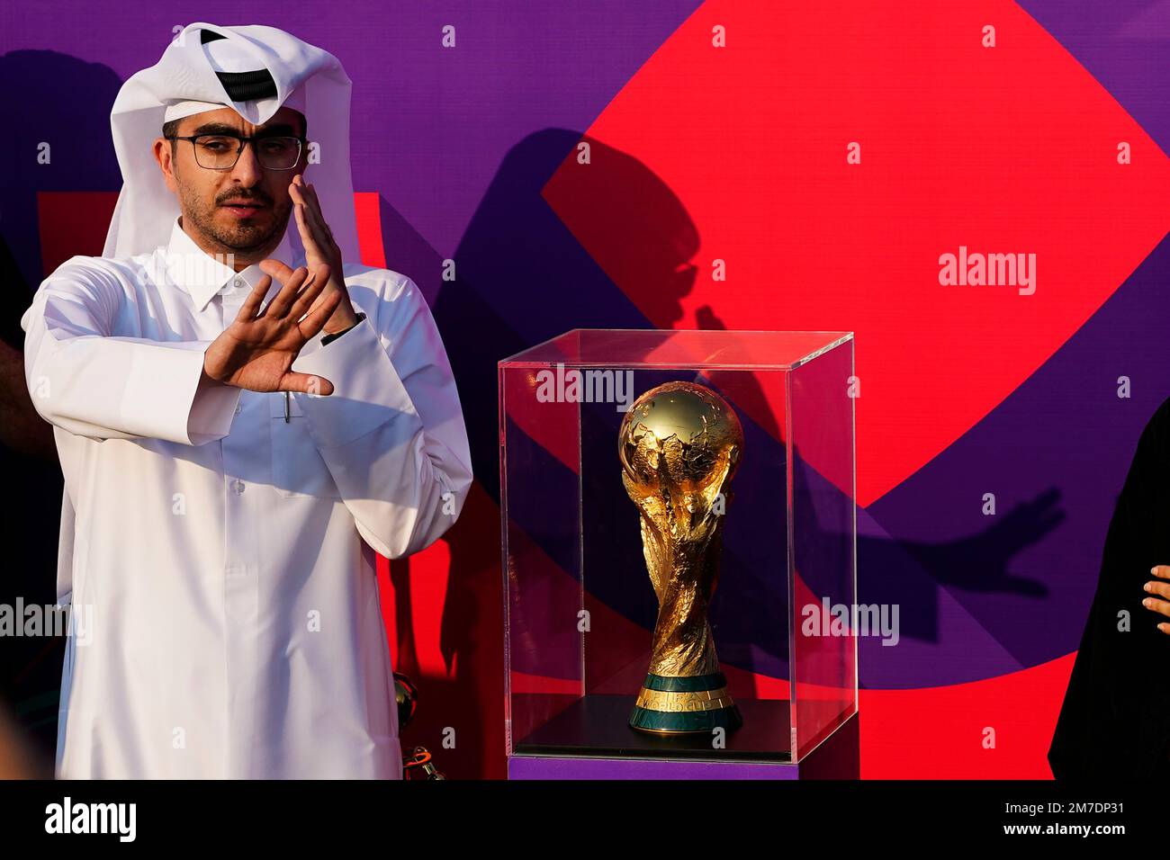 A man poses with the World Cup Trophy as it is on display at the ...