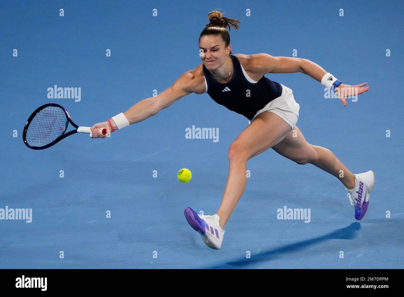 Maria Sakkari of Greece plays a forehand return to Italy's Martina ...