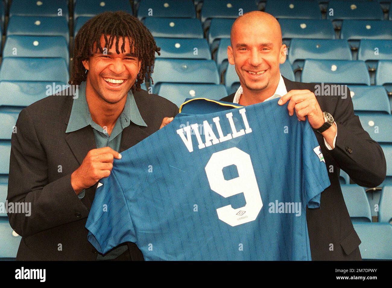 FILE - Chelsea's Gianluca Vialli, right, holds up his team jersey with ...