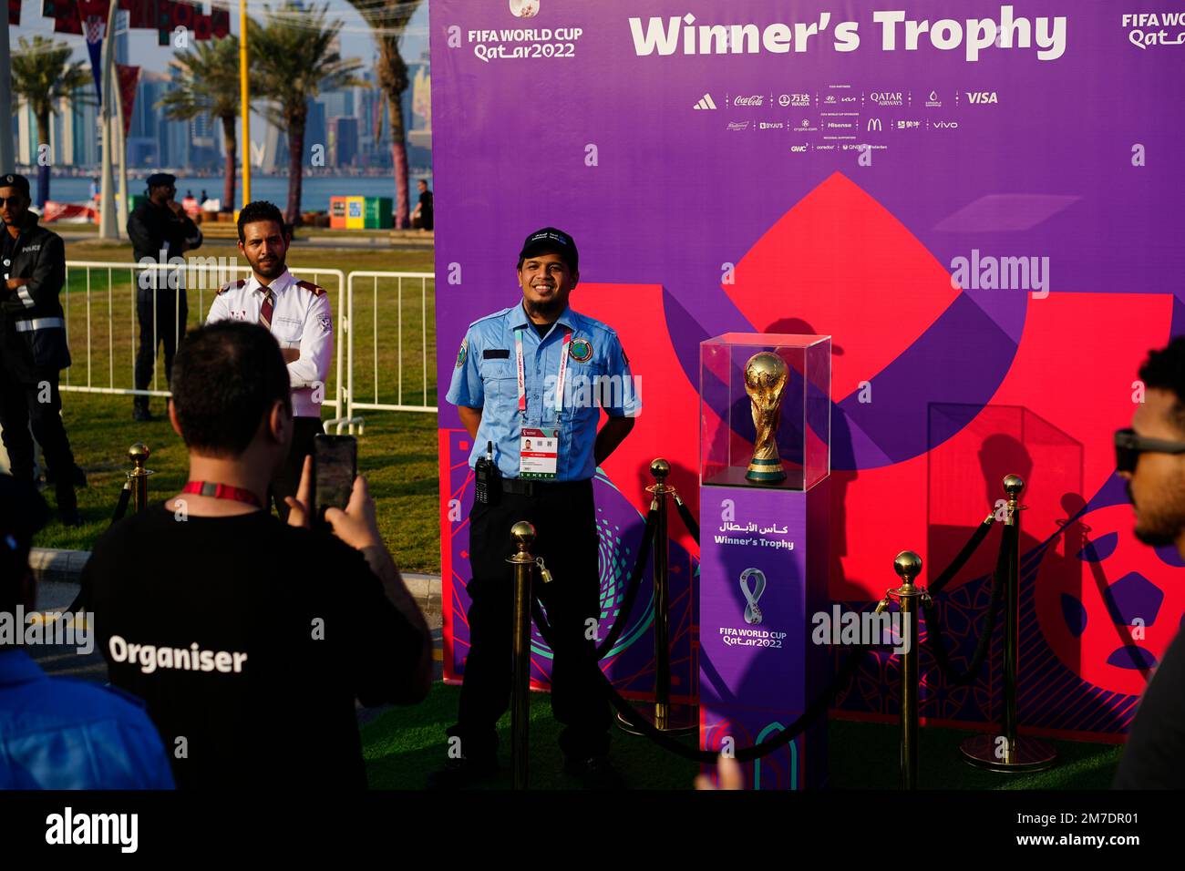 A man poses with the World Cup Trophy as it is on display at the ...