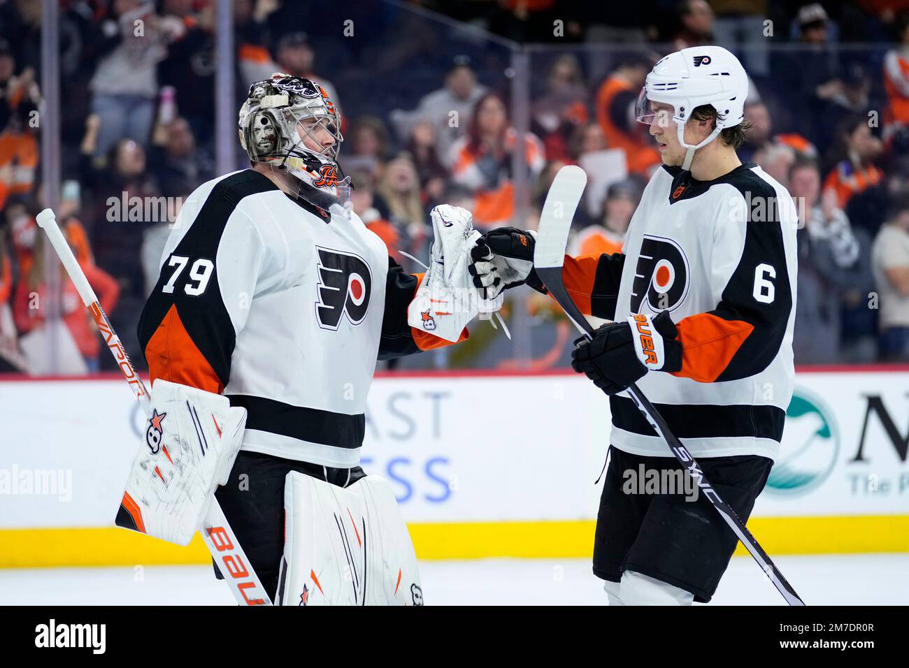 Philadelphia Flyers' Carter Hart, left, and Travis Sanheim celebrate ...