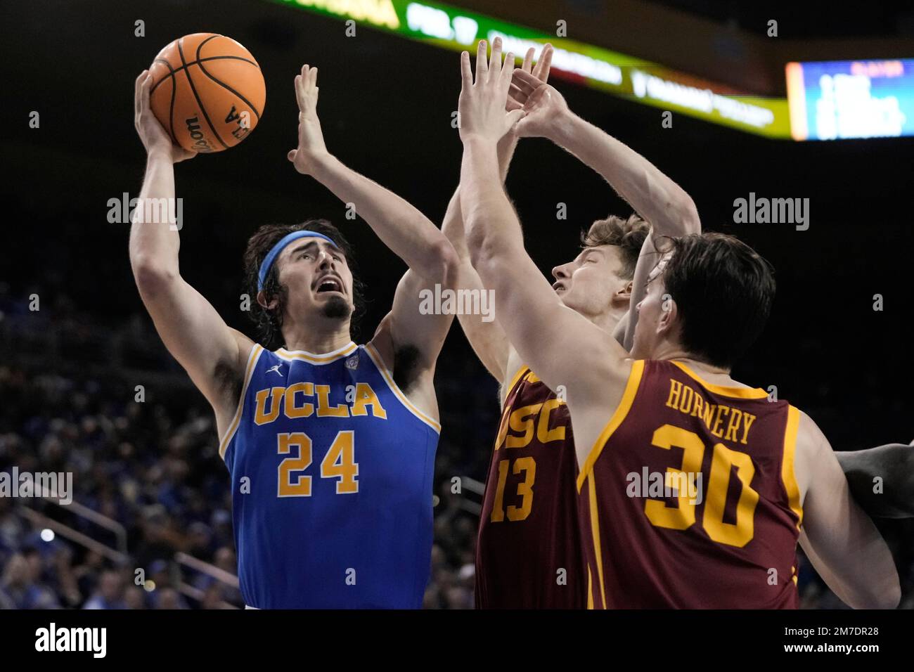 UCLA's Jaime Jaquez Jr. (24) is defended by Southern California's Drew ...