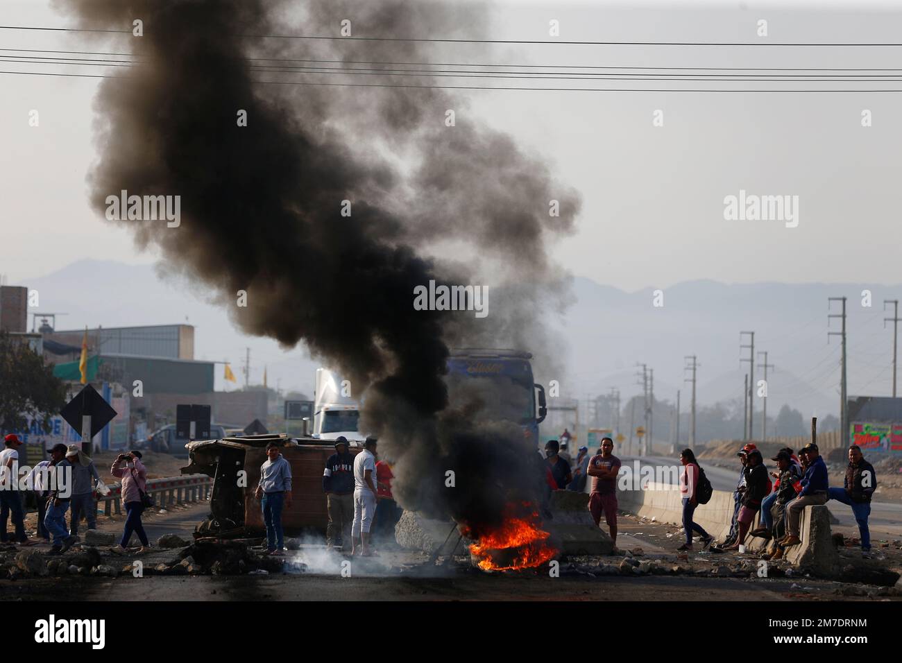 Supporters of ousted Peruvian President Pedro Castillo block the Pan ...
