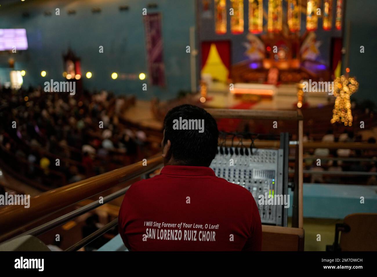 Α sound engineer works during a liturgy at the Catholic Church, Our ...