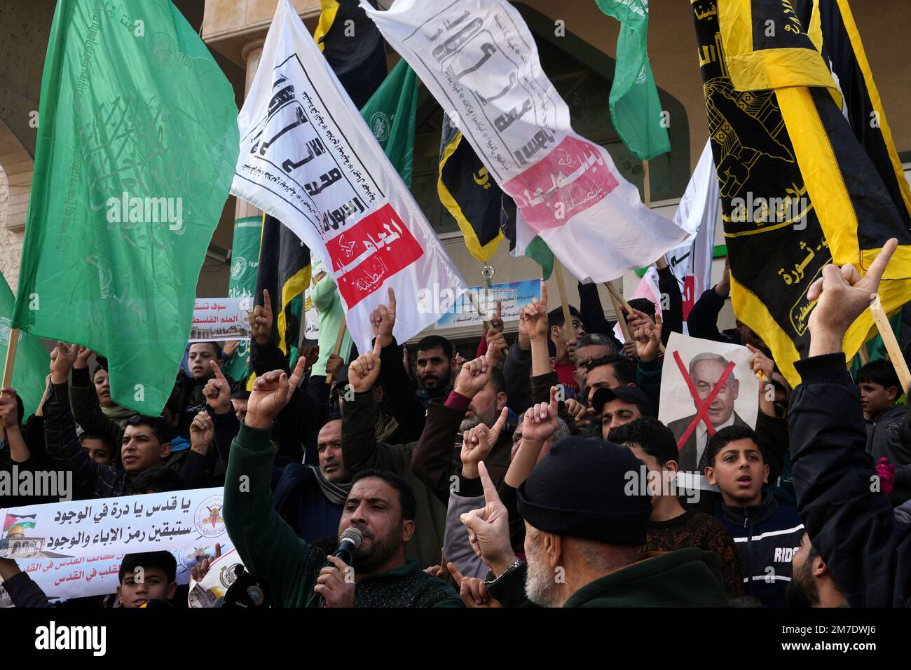 Hamas and Islamic Jihad supporters raise their hands up while chanting ...