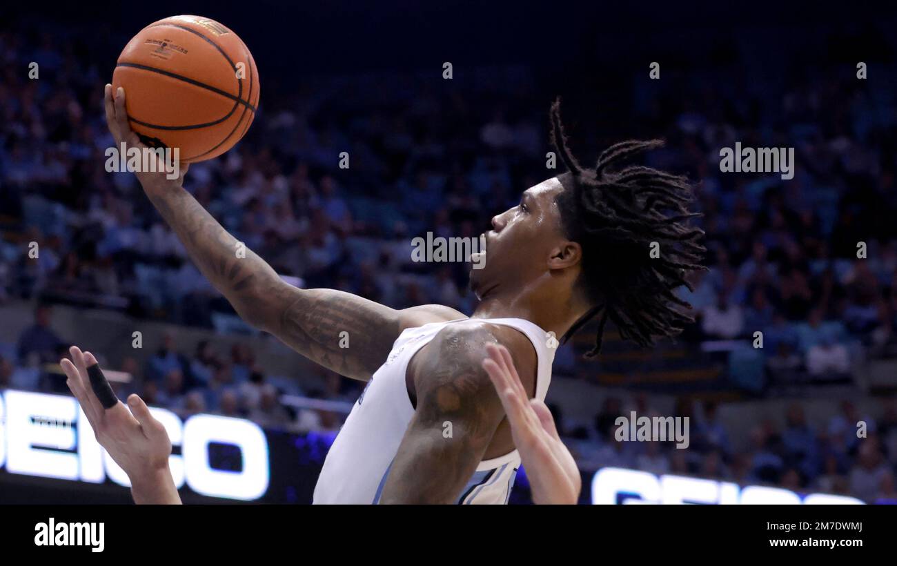 North Carolina guard Caleb Love drives to the hoop against Wake Forest ...