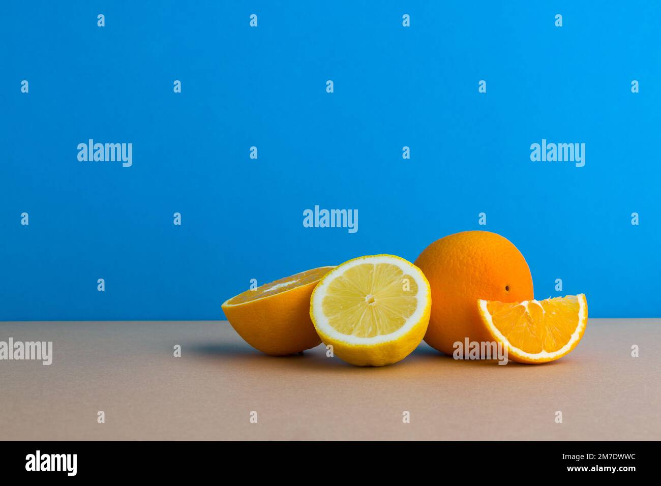 A front view of citrus in a blue background Stock Photo - Alamy
