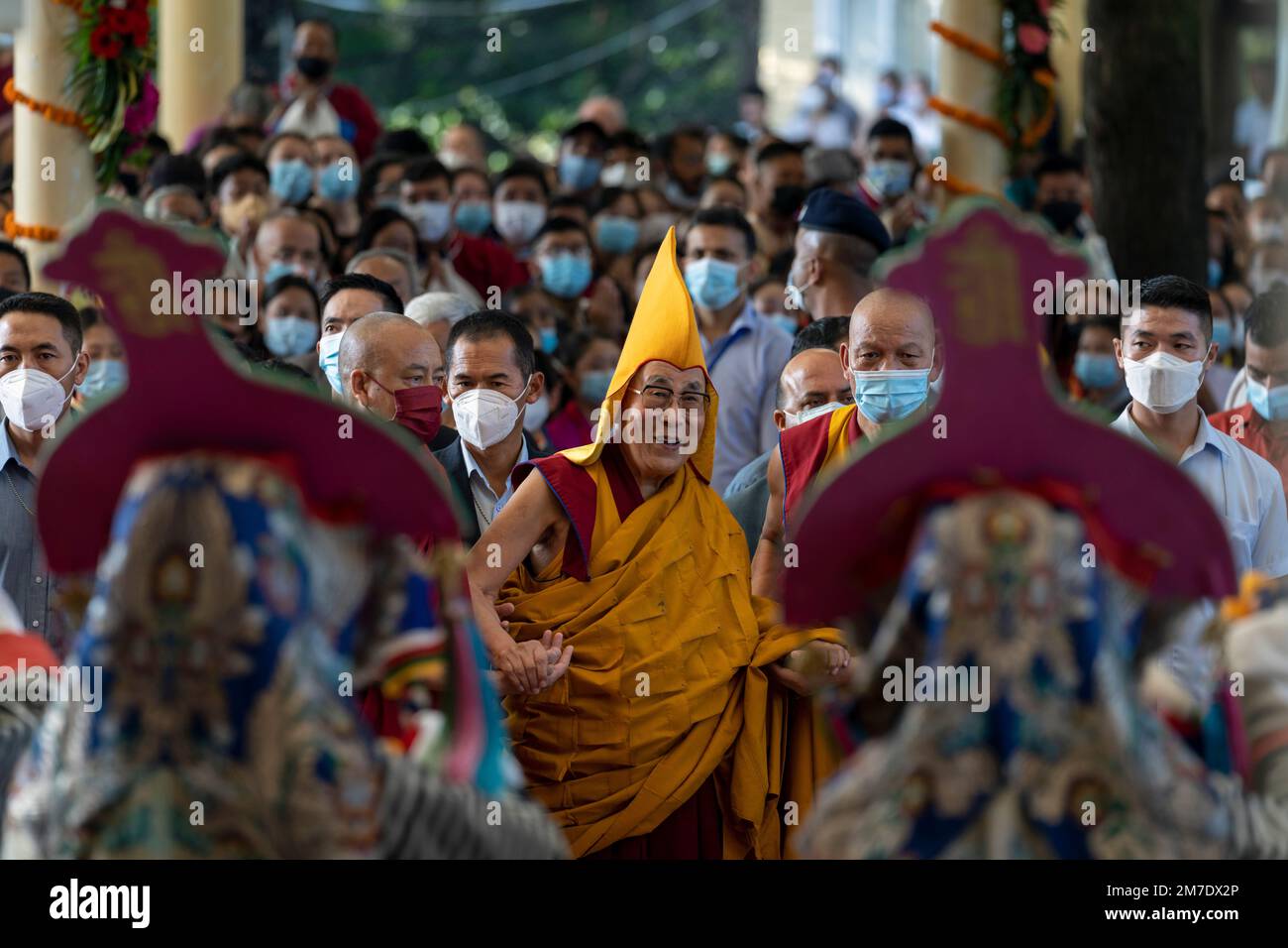 Tibetan spiritual leader the Dalai Lama, center, in a yellow ceremonial ...