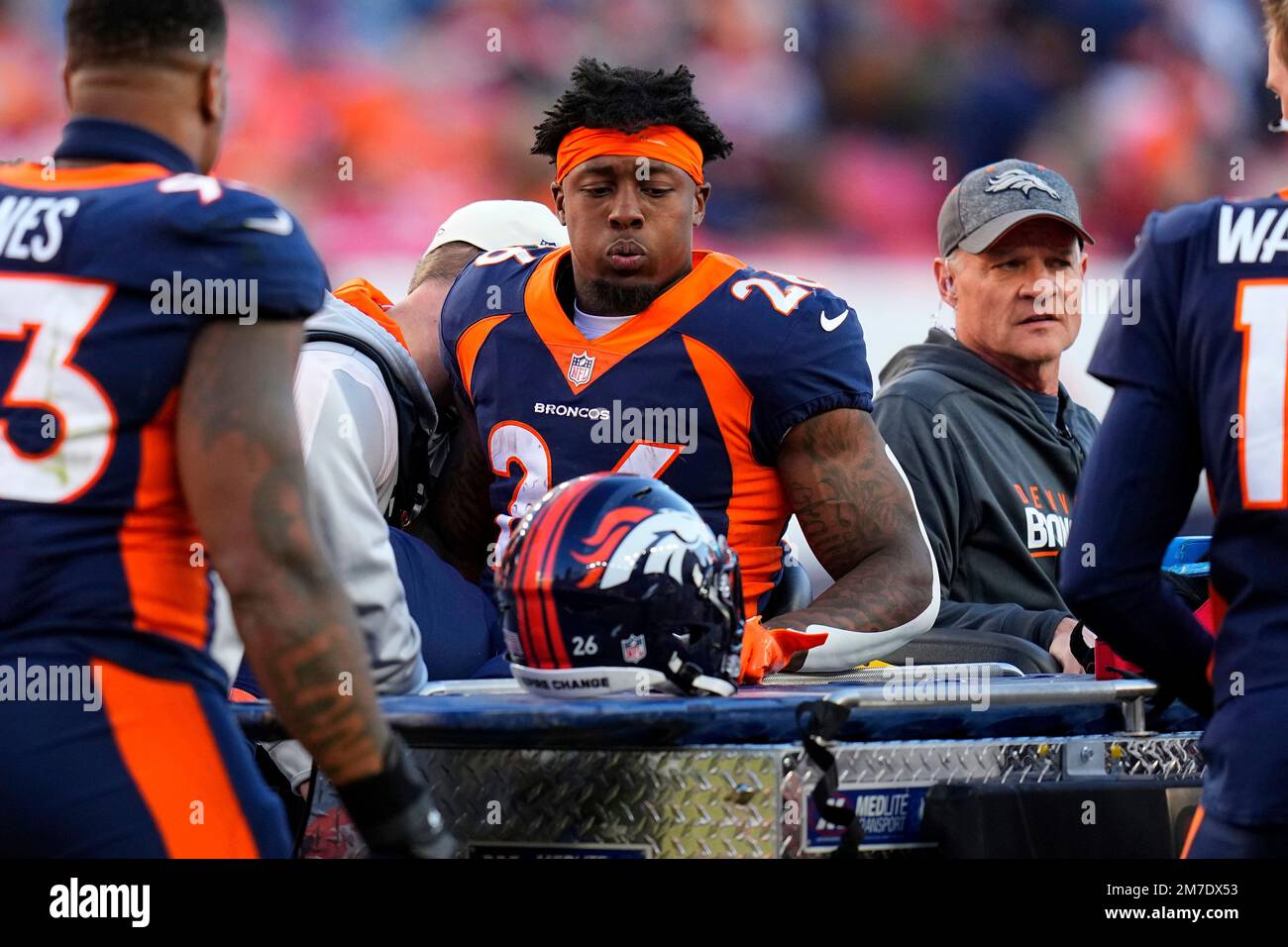 Denver Broncos running back Mike Boone (26) is sits on the cart after ...