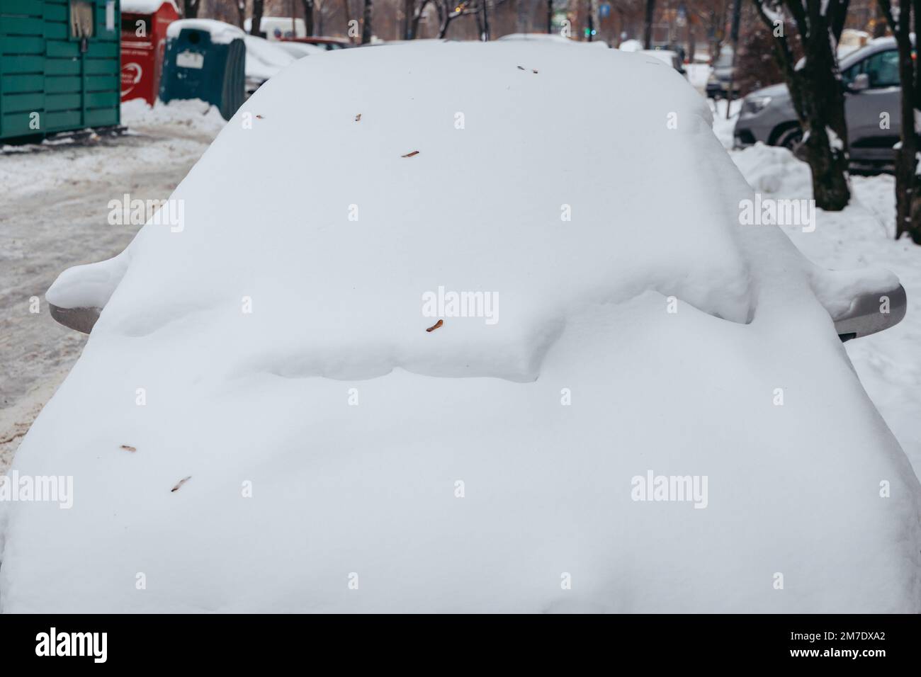 Car covered with snow in Warsaw city, capital of Poland Stock Photo - Alamy