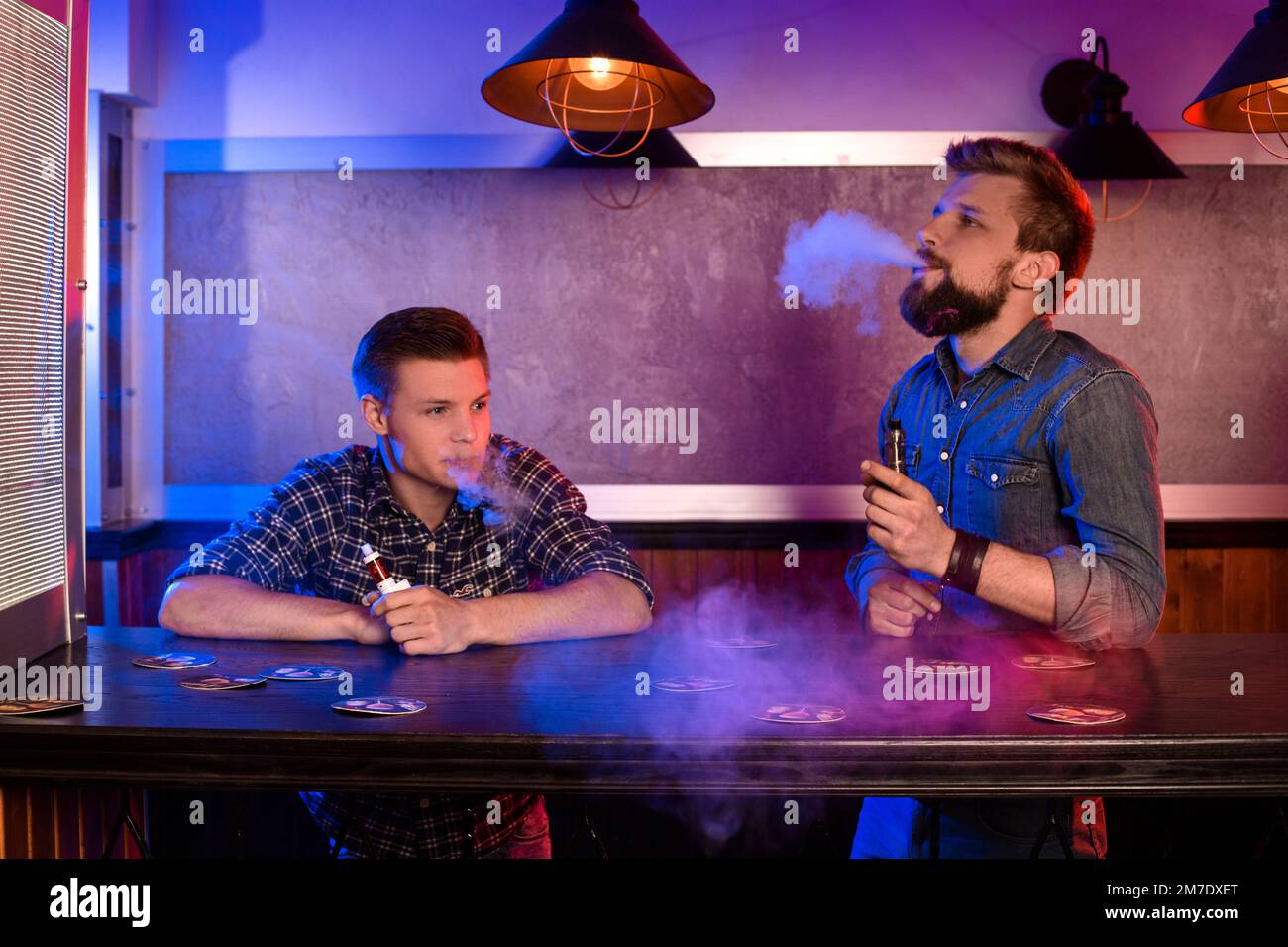 Vaping man holding mod cloud hi-res stock photography and images - Alamy