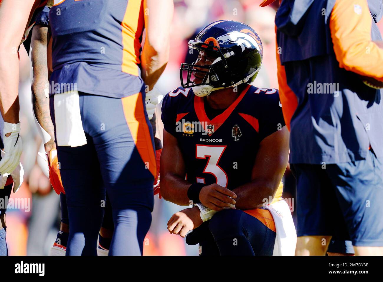 Denver Broncos quarterback Russell Wilson (3) huddles the offense ...