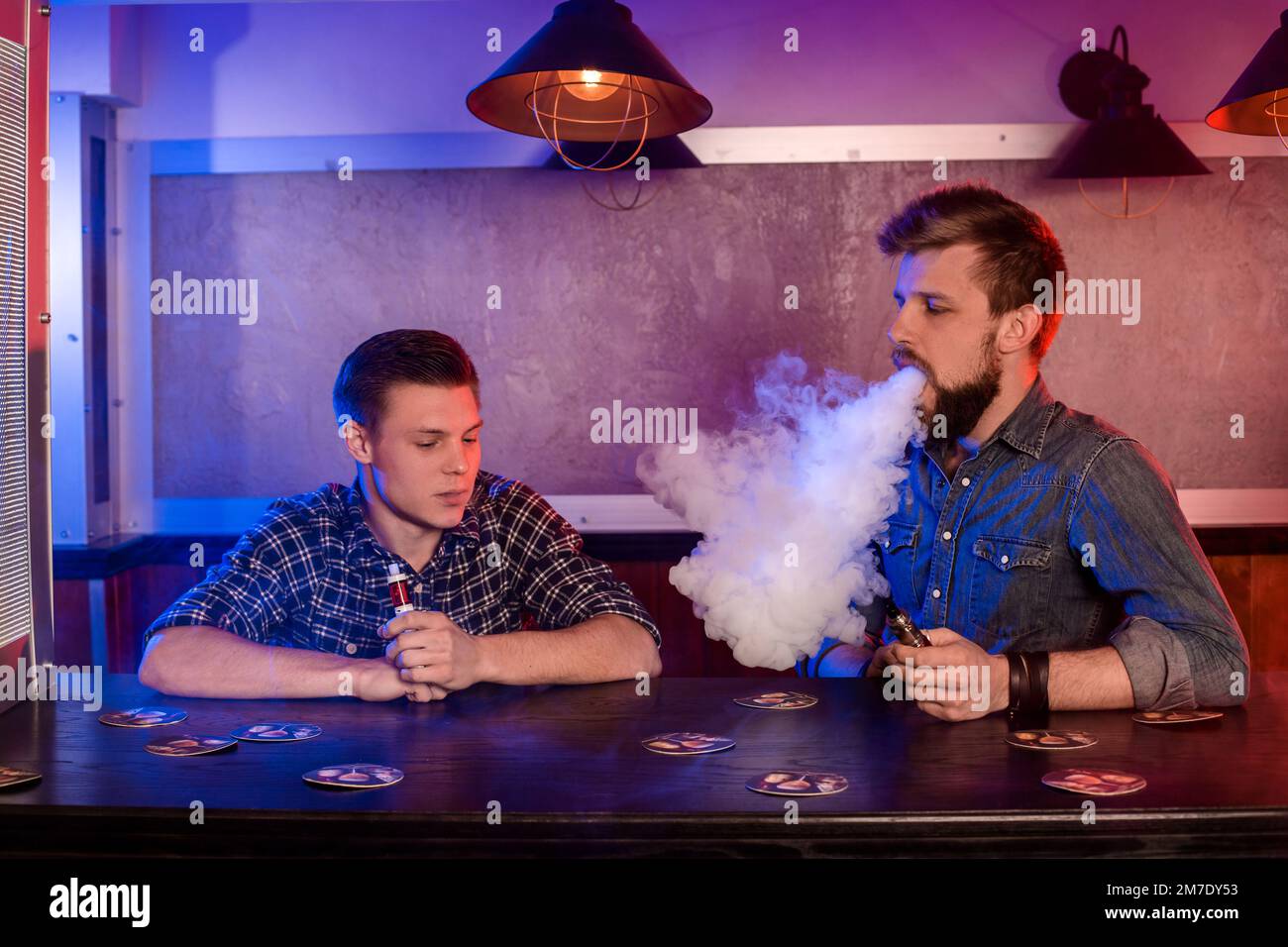 Vaping man holding mod cloud hi-res stock photography and images - Alamy