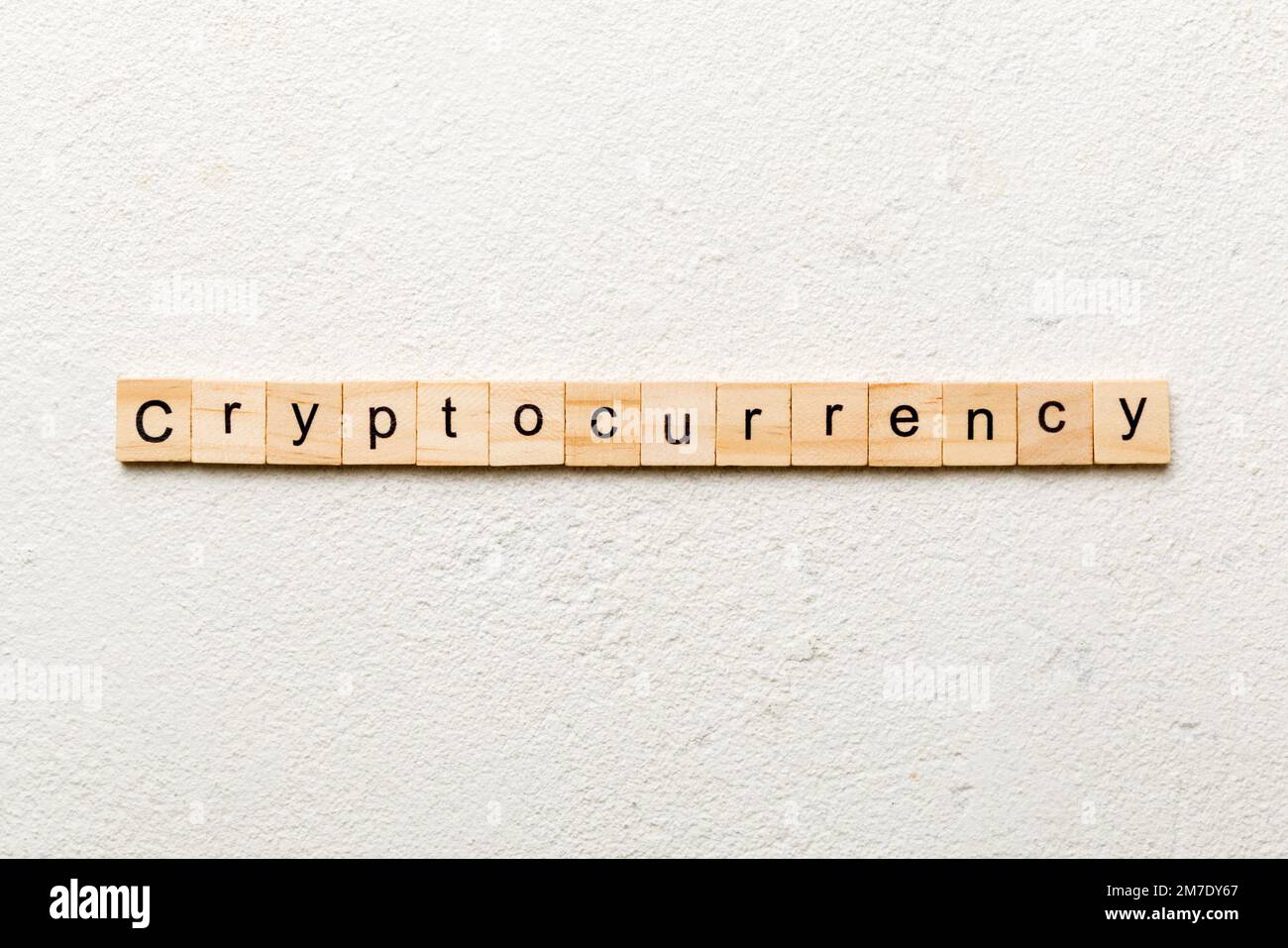 Cryptocurrency word written on wood block. Cryptocurrency text on ...