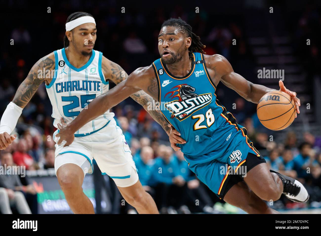 Detroit Pistons center Isaiah Stewart, right, drives past Charlotte ...