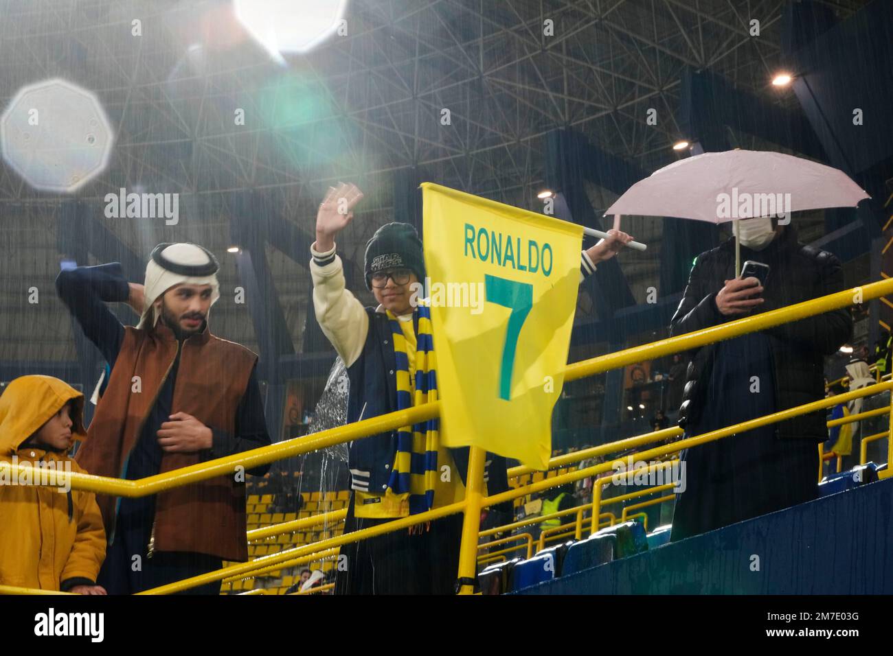 Al Nassr fans attend during heavy rains their team match against Al Tai ...