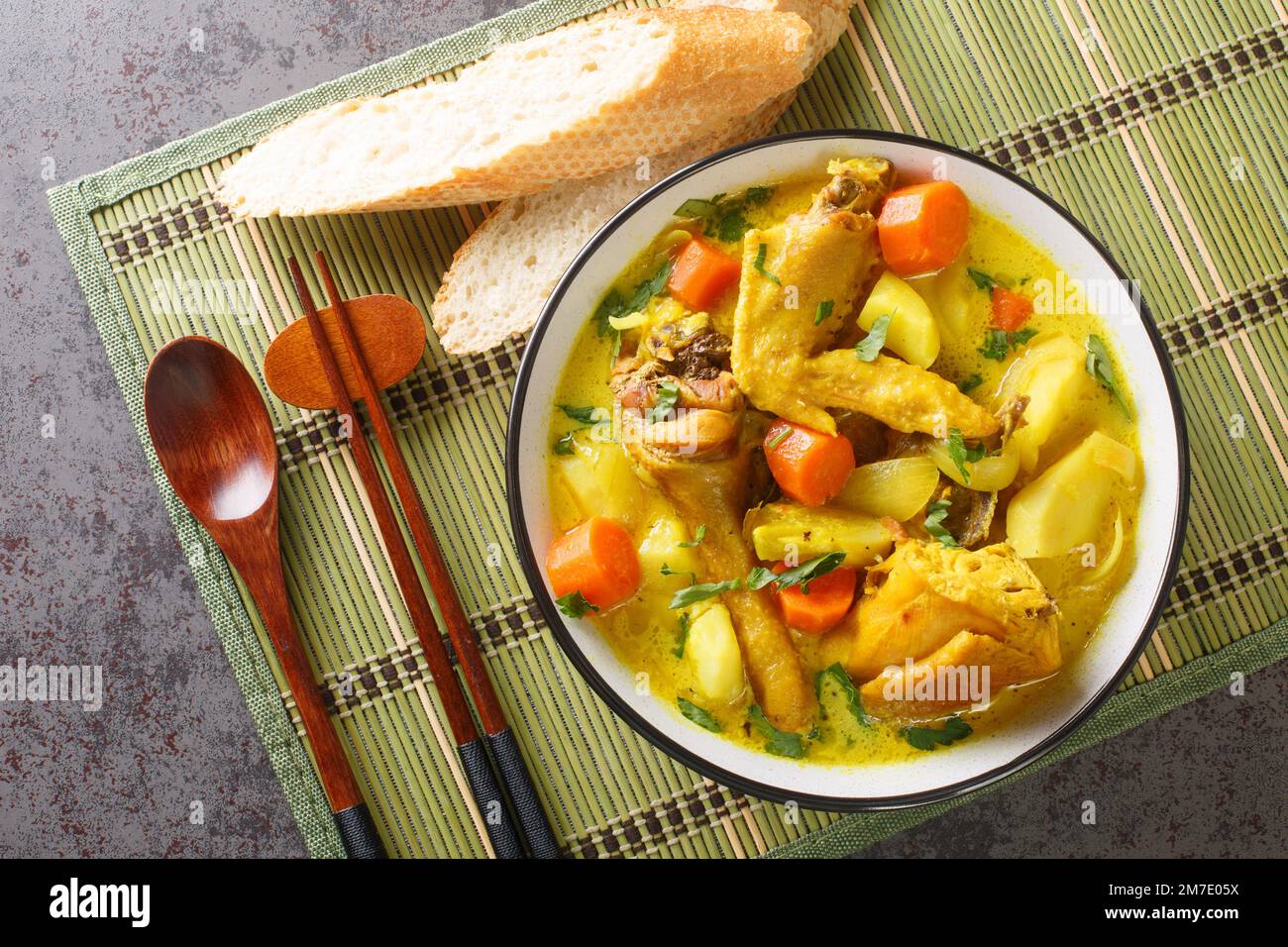 Ca Ri Ga Vietnamese Coconut Chicken Curry with vegetables close-up in a ...