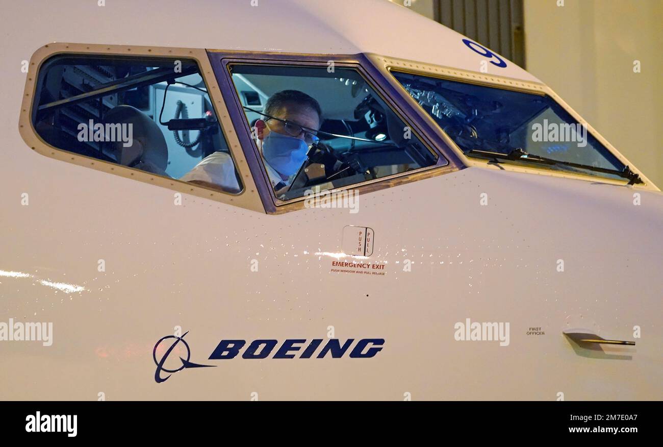 FILE - Capt. Brian Eyre, who was serving as first officer, goes through pre-flight preparations ...