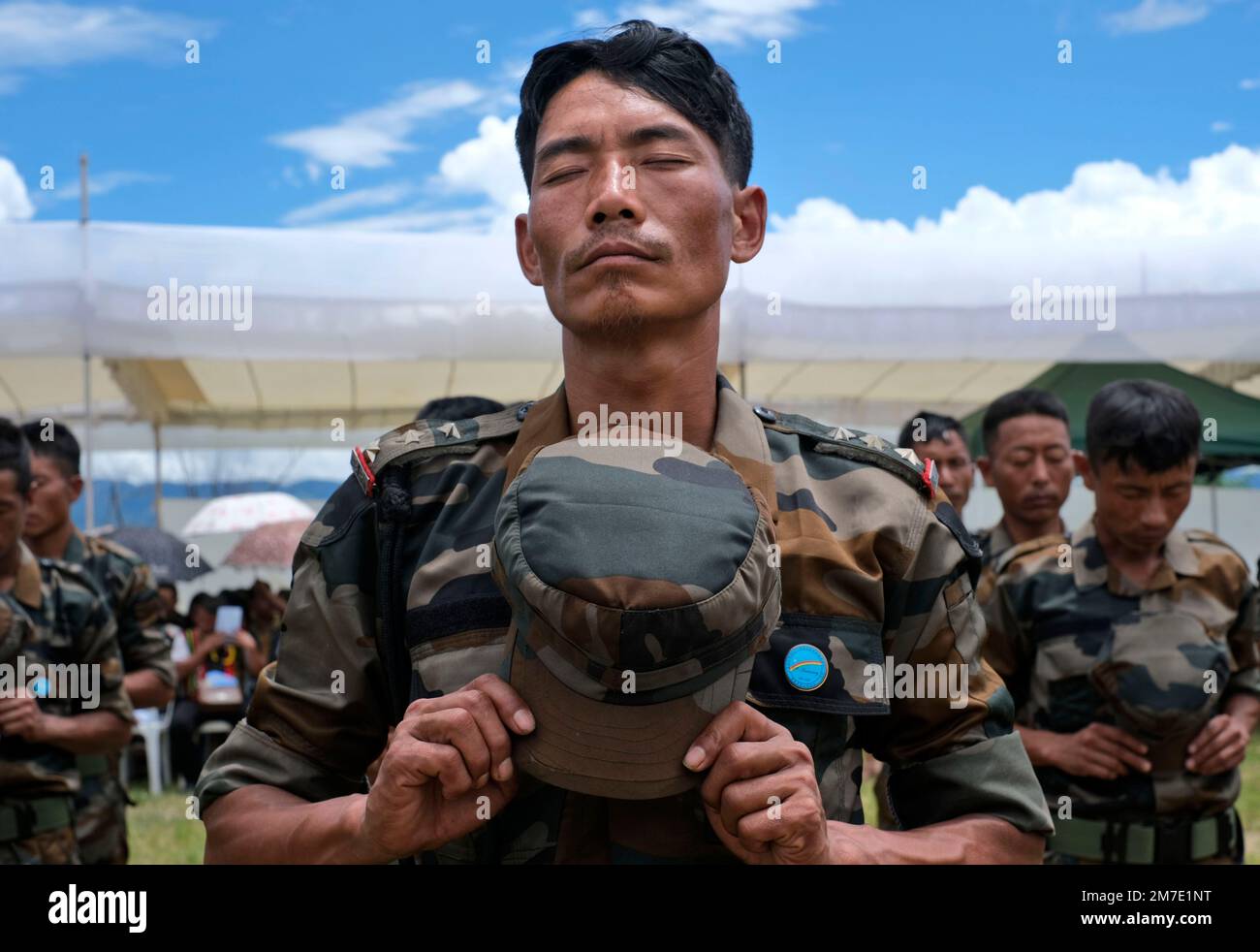 A Naga Army soldier stands in prayer during celebrations marking the ...