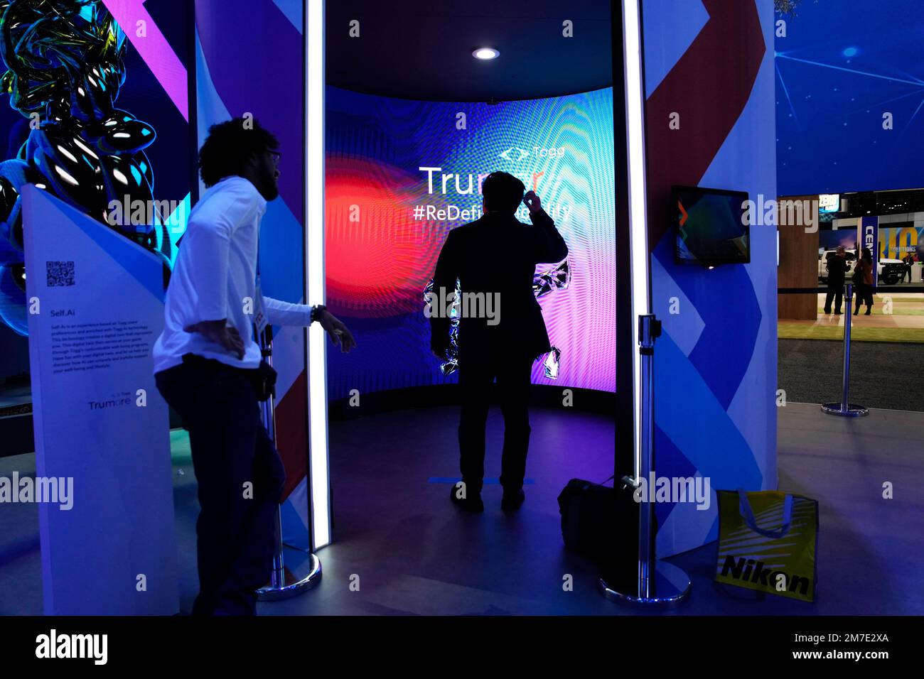An attendee tours the Togg booth during the CES tech show Friday, Jan ...