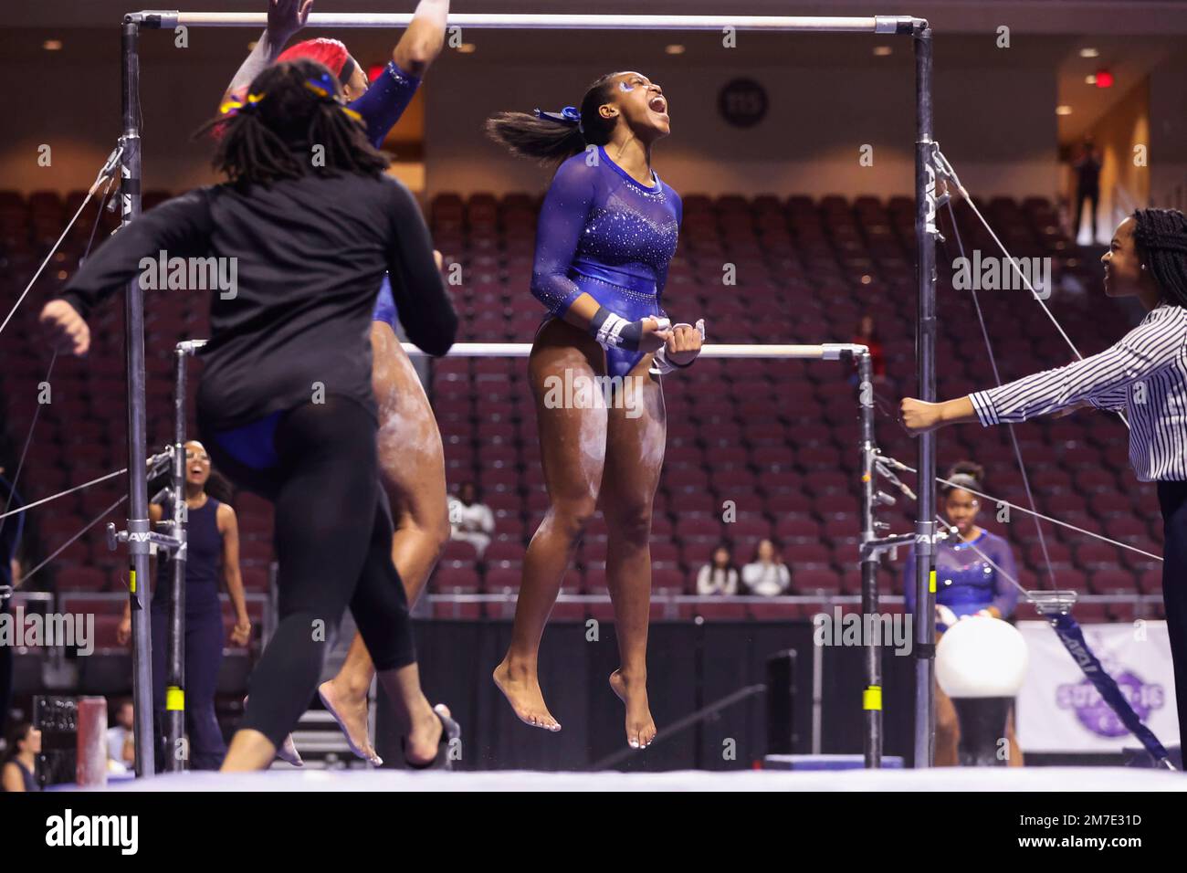 Fisk University's Morgan Price lands from the uneven bars during a ...