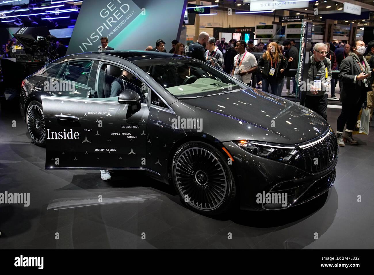 People view the Mercedes-Benz AMG EQS sedan during the CES tech show Friday, Jan. 6, 2023, in ...