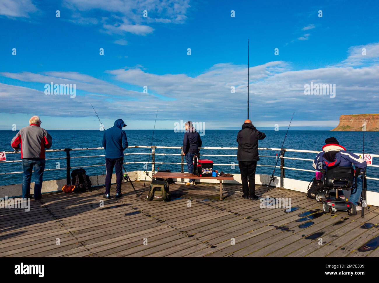 Group of people fishing at the end of Saltburn Pier in Saltburn-by-the ...