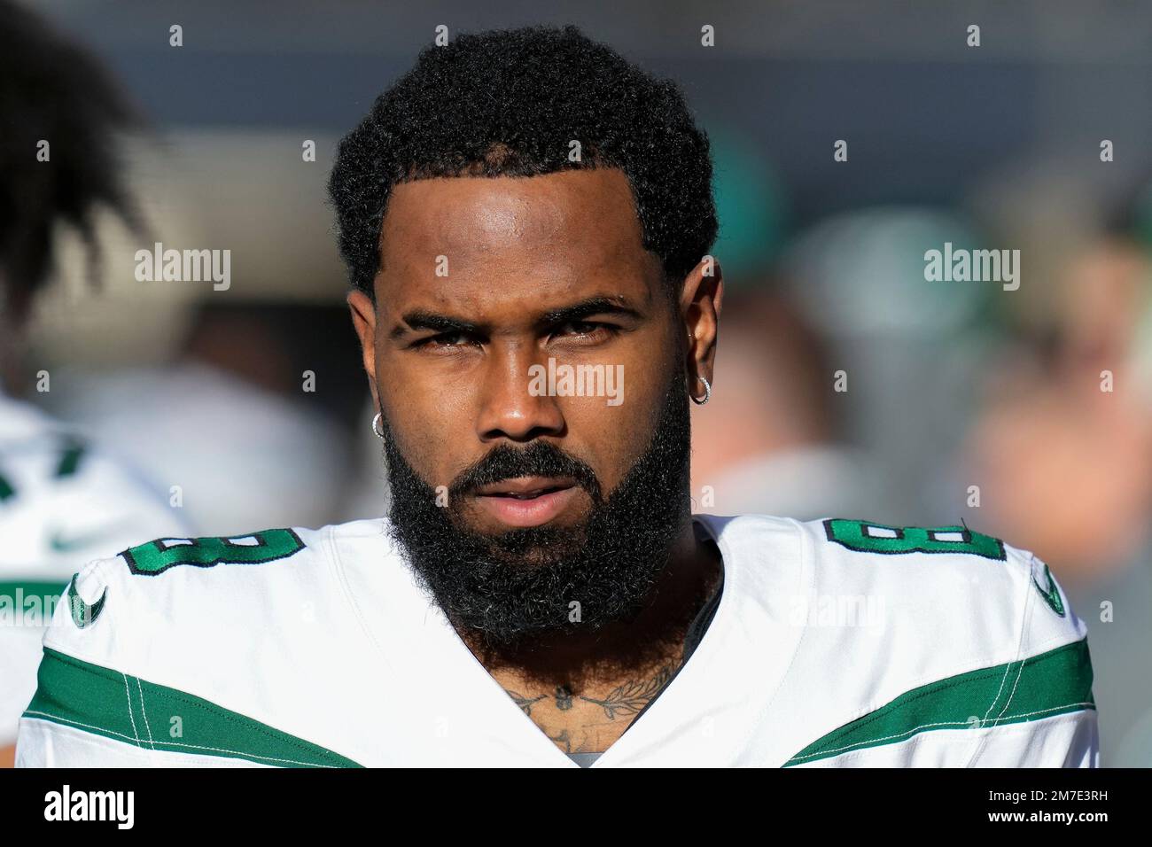 New York Jets wide receiver Elijah Moore stands on the sideline before ...