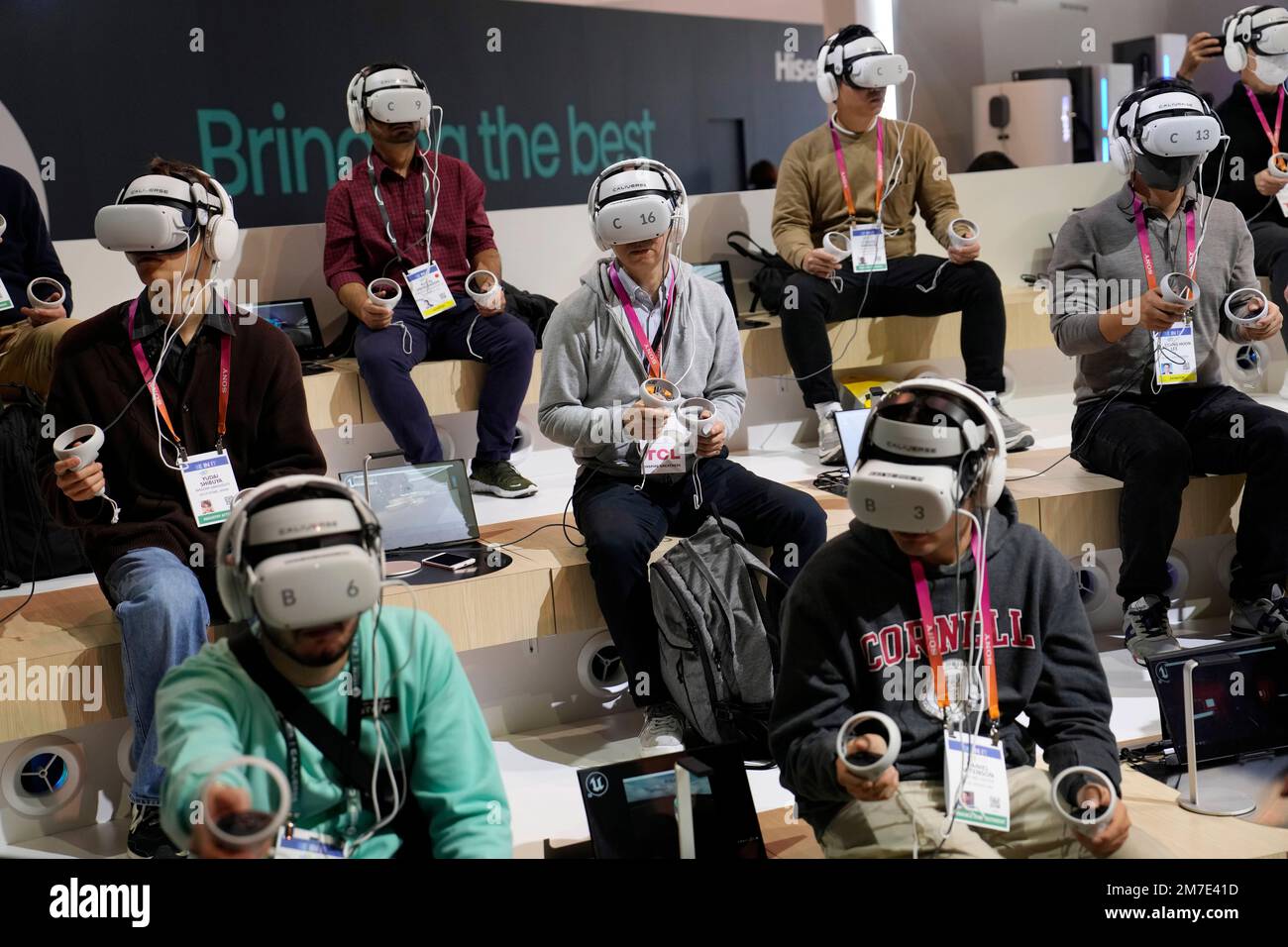 Attendees wear VR headsets while previewing the Caliverse Hyper ...