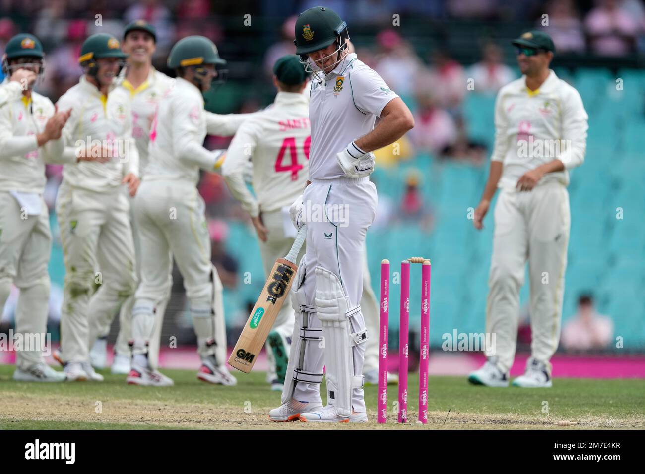 South Africa's Sarel Erwee looks down to see he is bowled by Australia ...