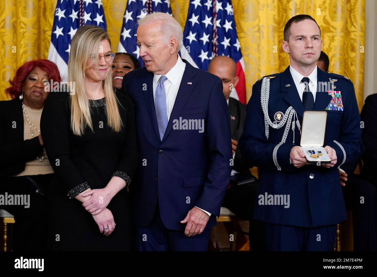 President Joe Biden speaks with Erin Smith, widow of Washington ...