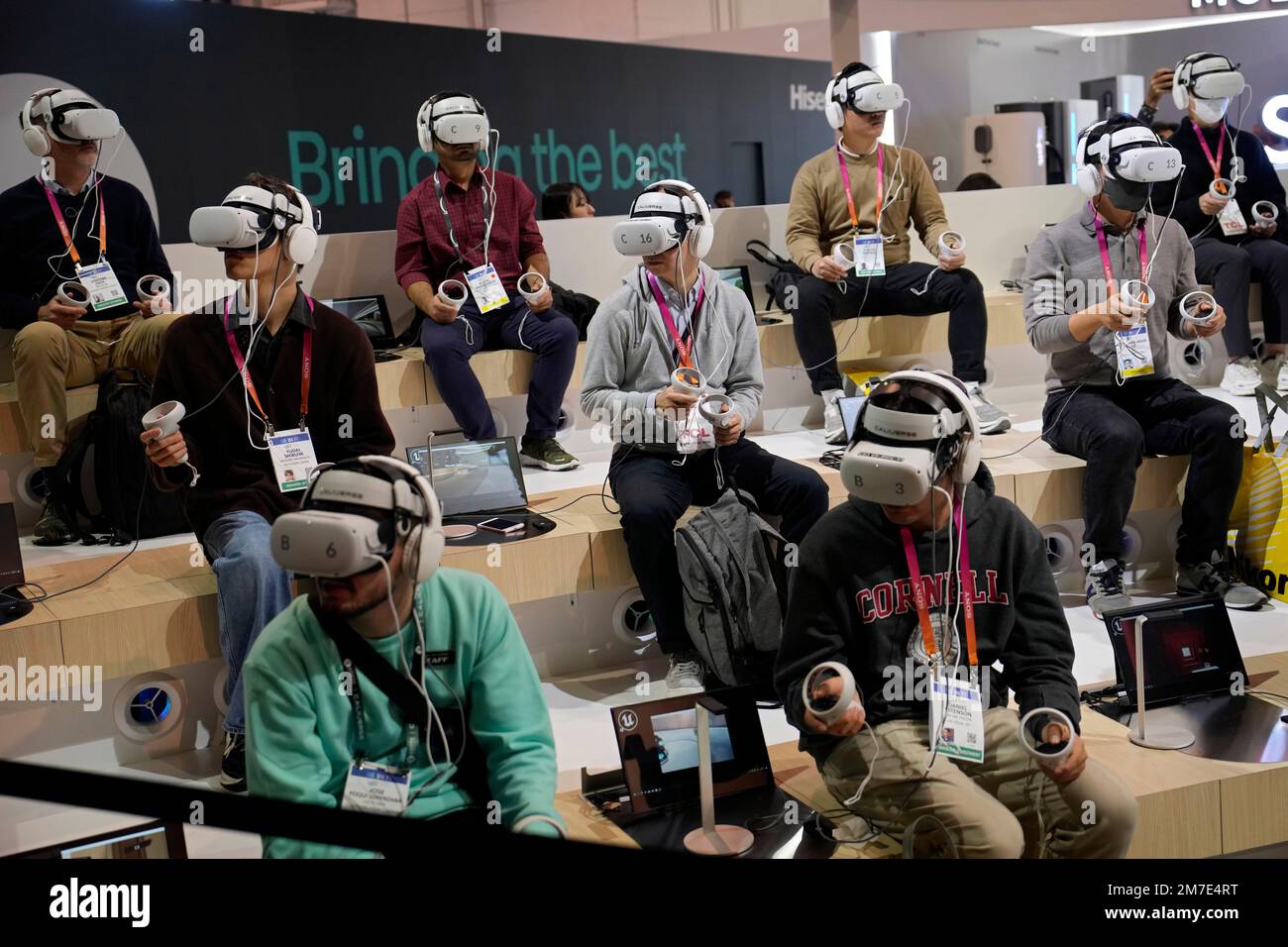 Attendees wear VR headsets while previewing the Caliverse Hyper ...