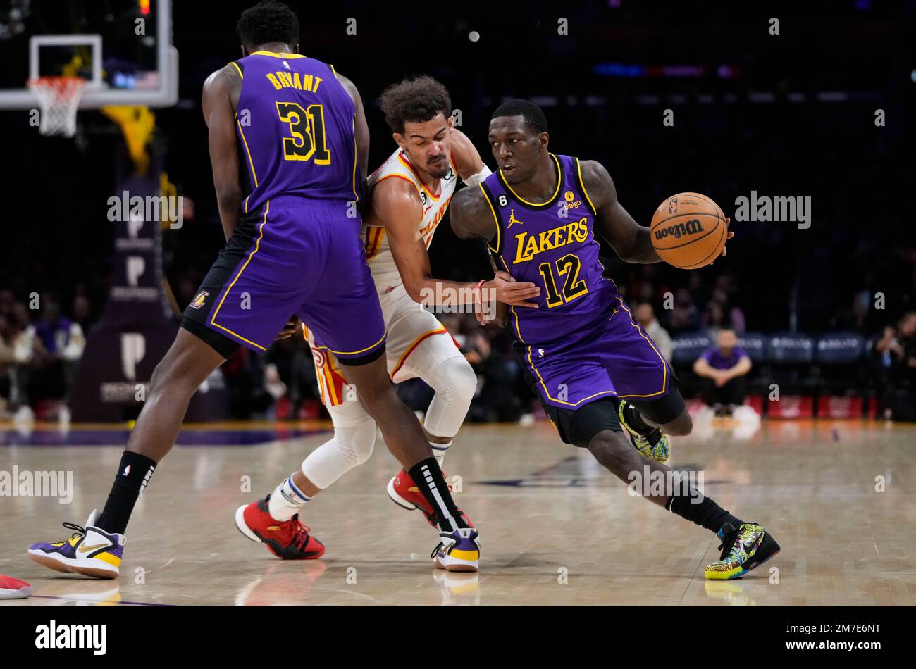Los Angeles Lakers' Kendrick Nunn (12) dribbles as Atlanta Hawks' Trae ...