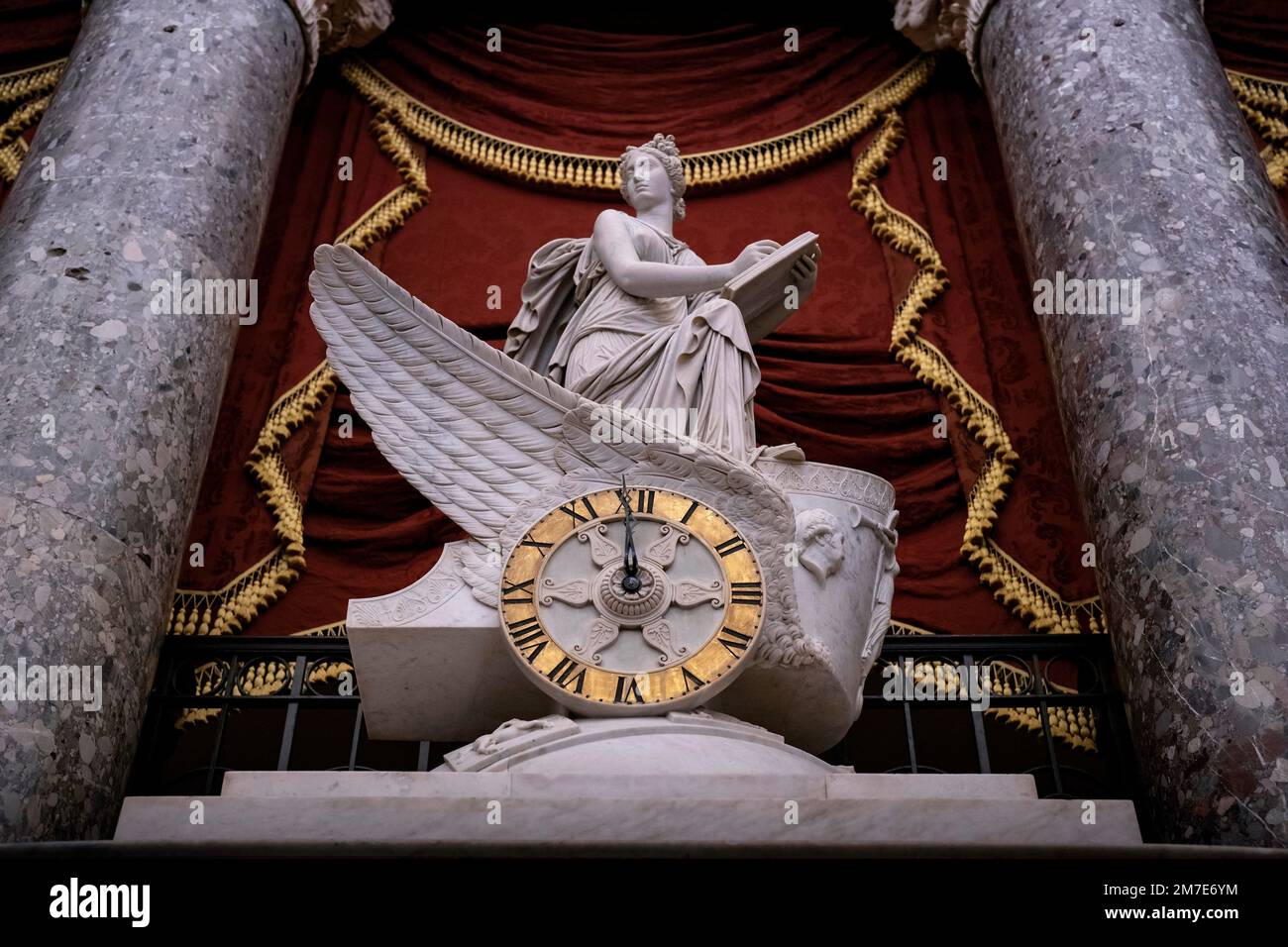 The clock marks midnight on the sculpture of Clio, the muse of history ...