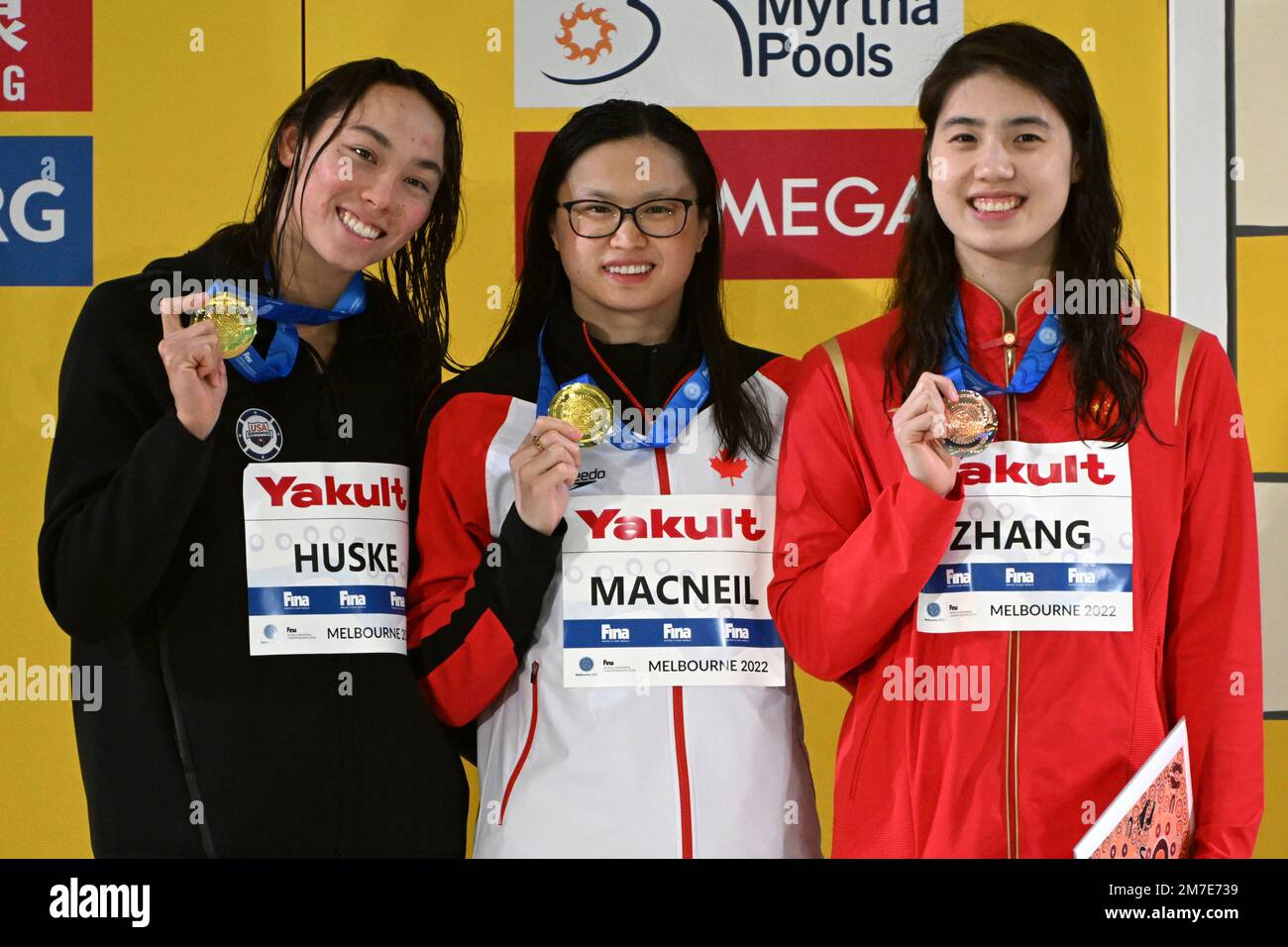 Margaret MacNeil of Canada, center, Torri Huske of the U.S., left, and ...