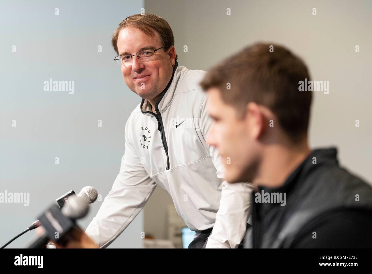 Missouri head football coach Elias Drinkwitz, left, looks at his new ...