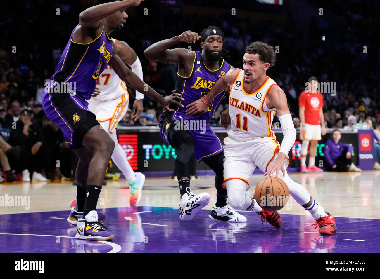 Atlanta Hawks' Trae Young (11) is defended by Los Angeles Lakers ...