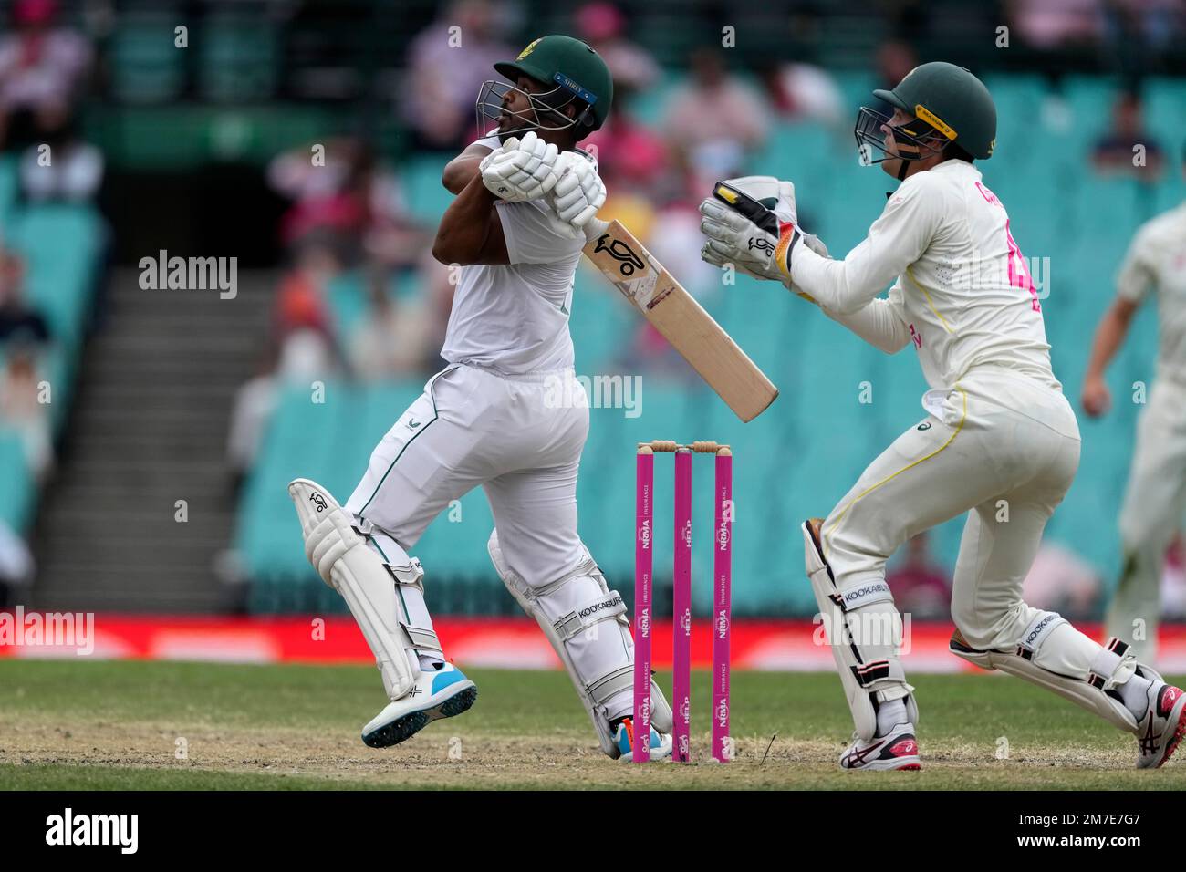 South Africa's Khaya Zondo, left, bats in front of Australia's Alex ...