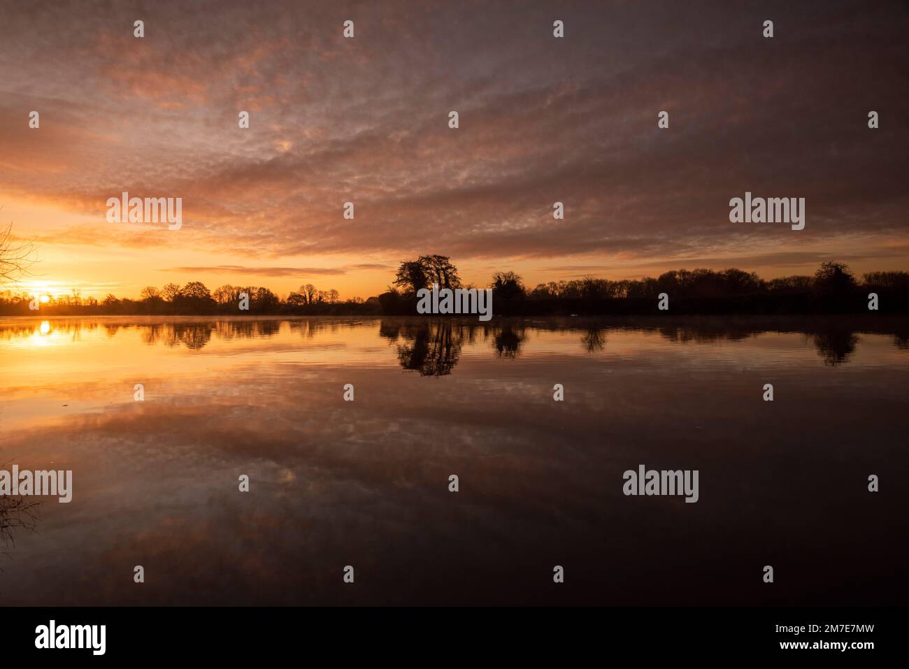 Sunrise reflections on the River Trent at Colwick Park in Nottingham ...