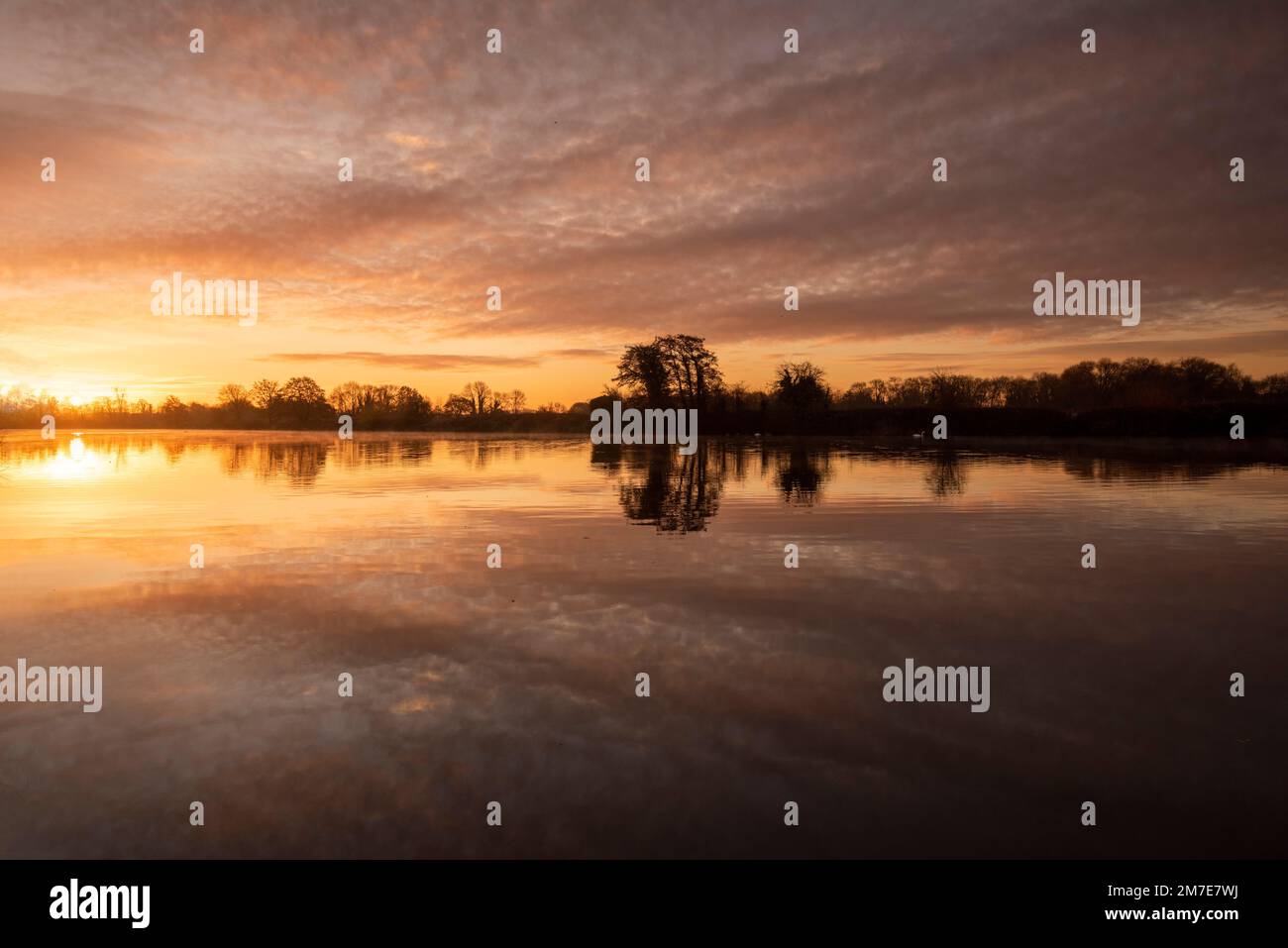 Sunrise reflections on the River Trent at Colwick Park in Nottingham ...