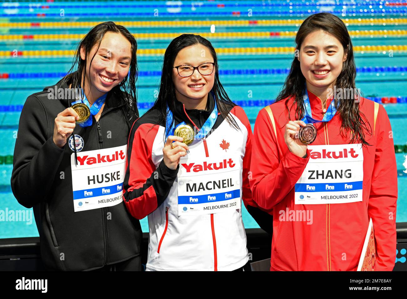 Margaret MacNeil of Canada, center, Torri Huske of the U.S., left, and ...
