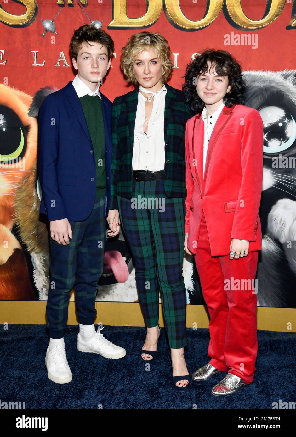 Amy Carlson, center, poses with her children Nigel Butler, left, and ...