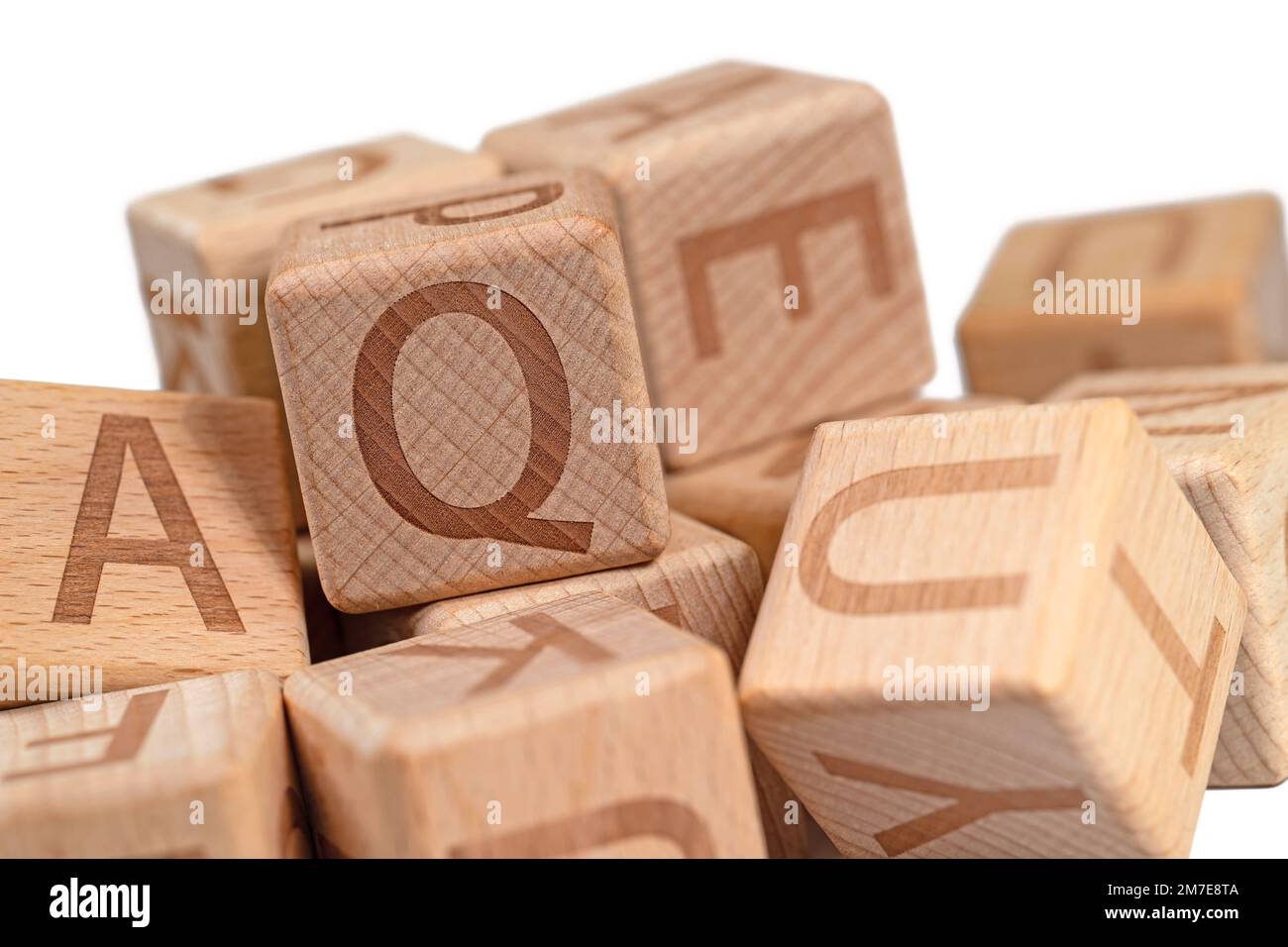 Wooden cubes with letters against a white background Stock Photo - Alamy