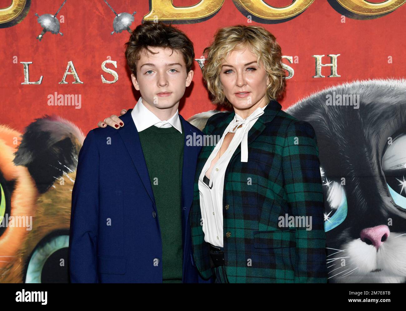 Amy Carlson, right, and son Nigel Butler attend the premiere of "Puss ...