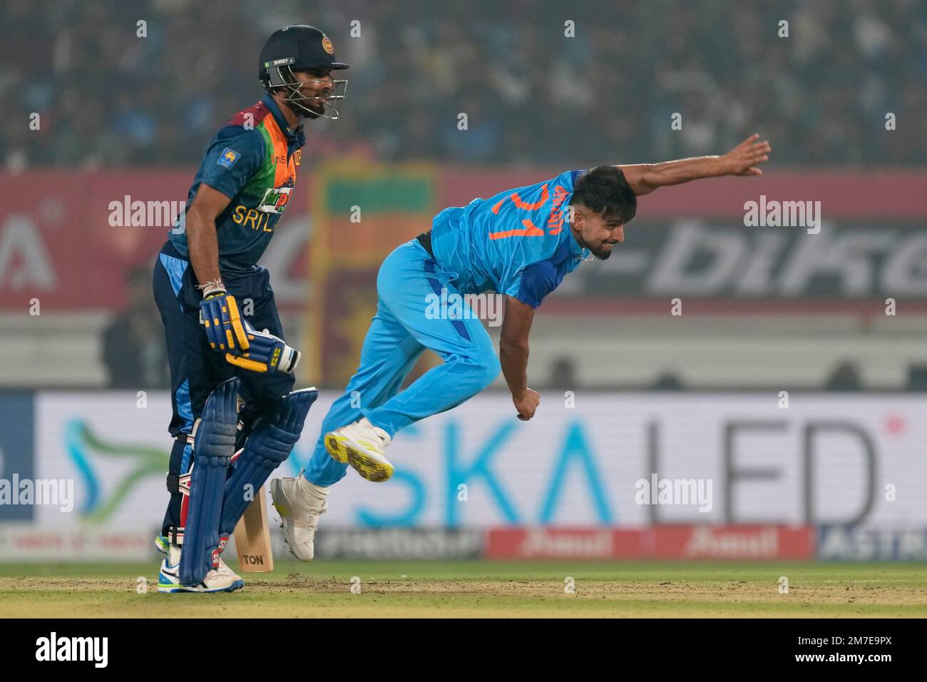 India's Umran Malik, right, bowls a delivery during the third T20 ...