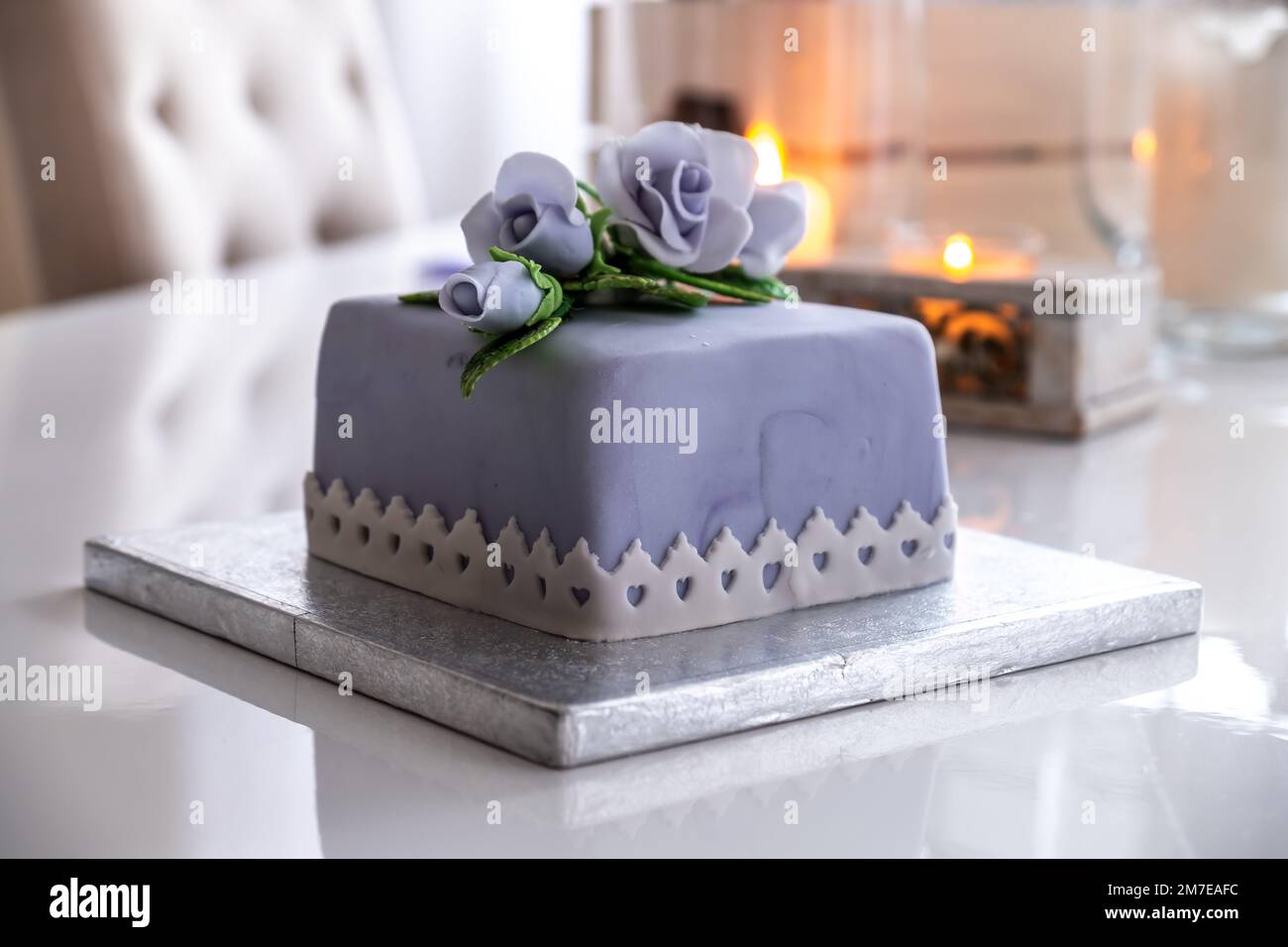 Beautiful decorated fruit cake with blue roses Stock Photo - Alamy