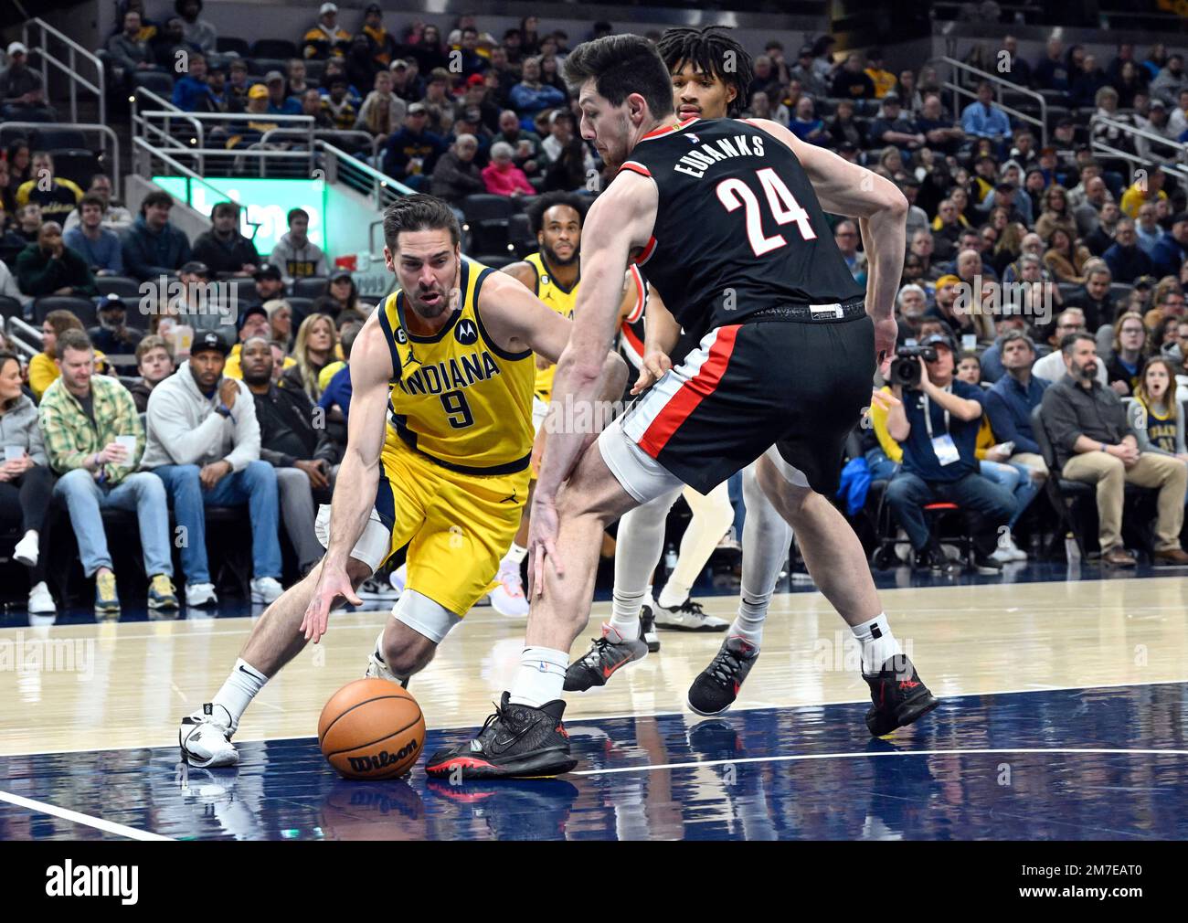 Indiana Pacers guard T.J. McConnell (9) dribbles around Portland Trail ...